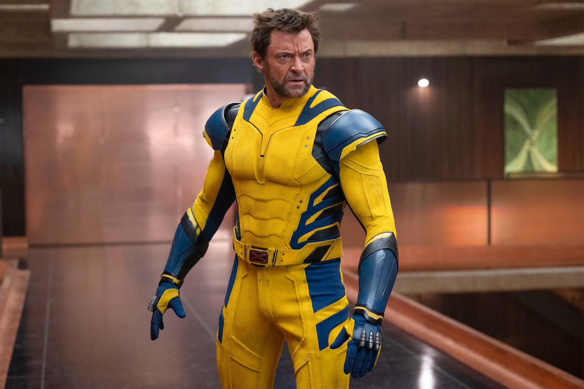 Hugh Jackman in yellow and blue as grown men sob - Pubity